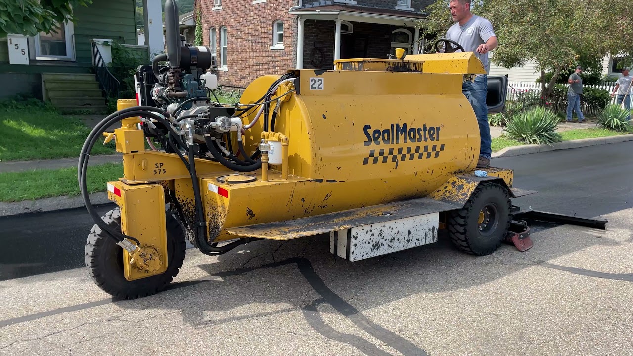 Liquid Road by SealMaster applied by City Public Works crew - YouTube