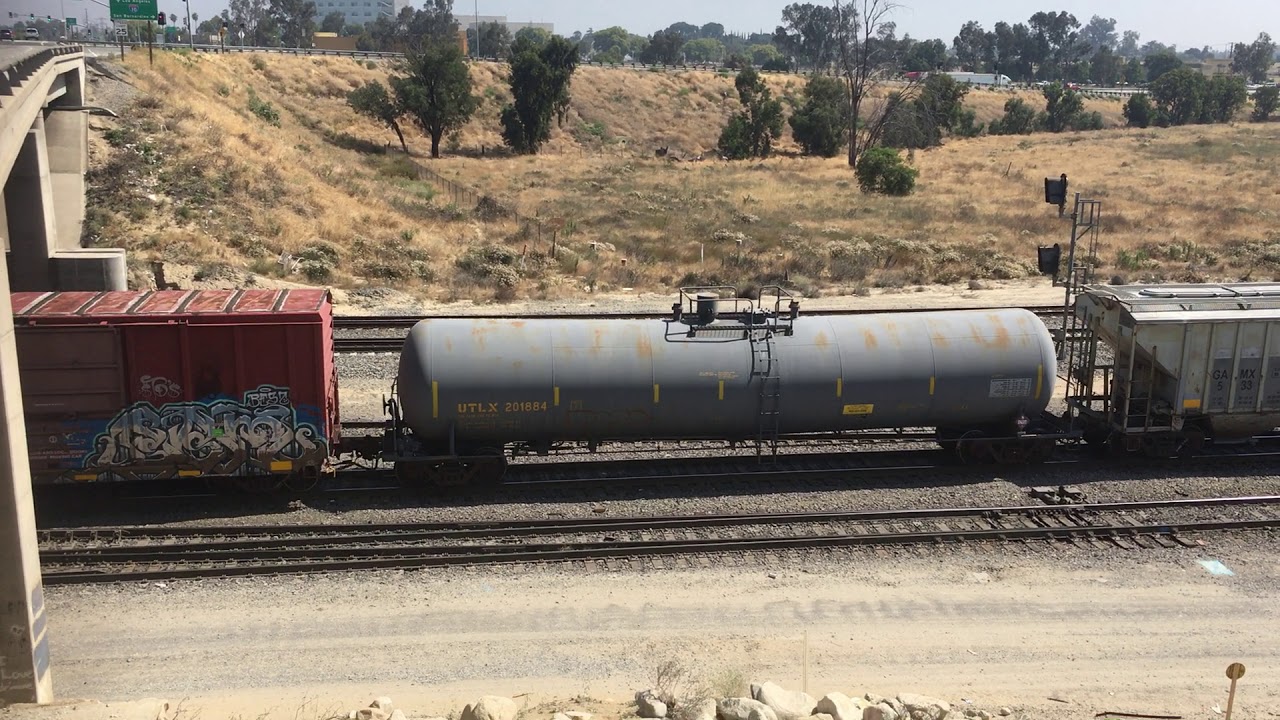 BNSF 7718 Westbound Manifest meets UP 8129 Northbound Manifest Train at ...