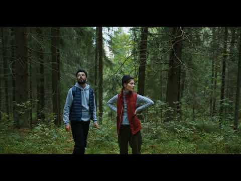 Teenage girls trekking in forest path