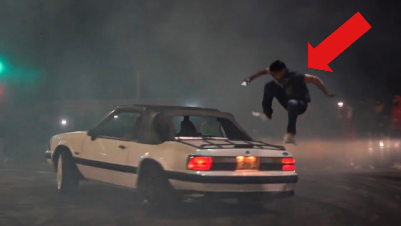 GUY JUMPS OVER CAR WHILE DOING DONUTS!! STOCKTON SIDESHOW!!! - YouTube