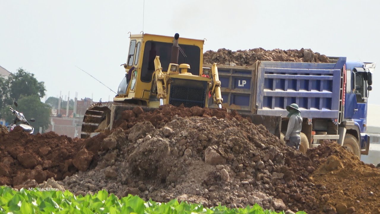 Incredible Machinery Bulldozer Pushing Dirt and Dump Truck Unloading ...