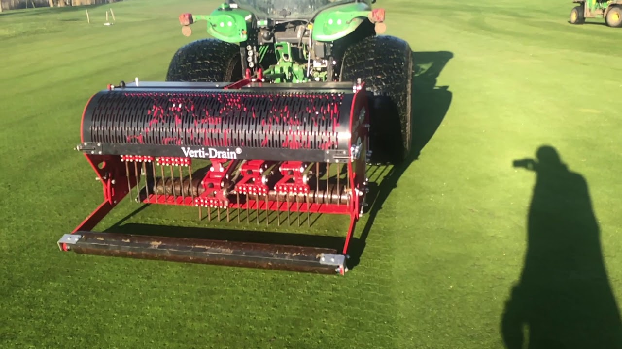 Greens verti-draining at Abridge Golf Club - YouTube