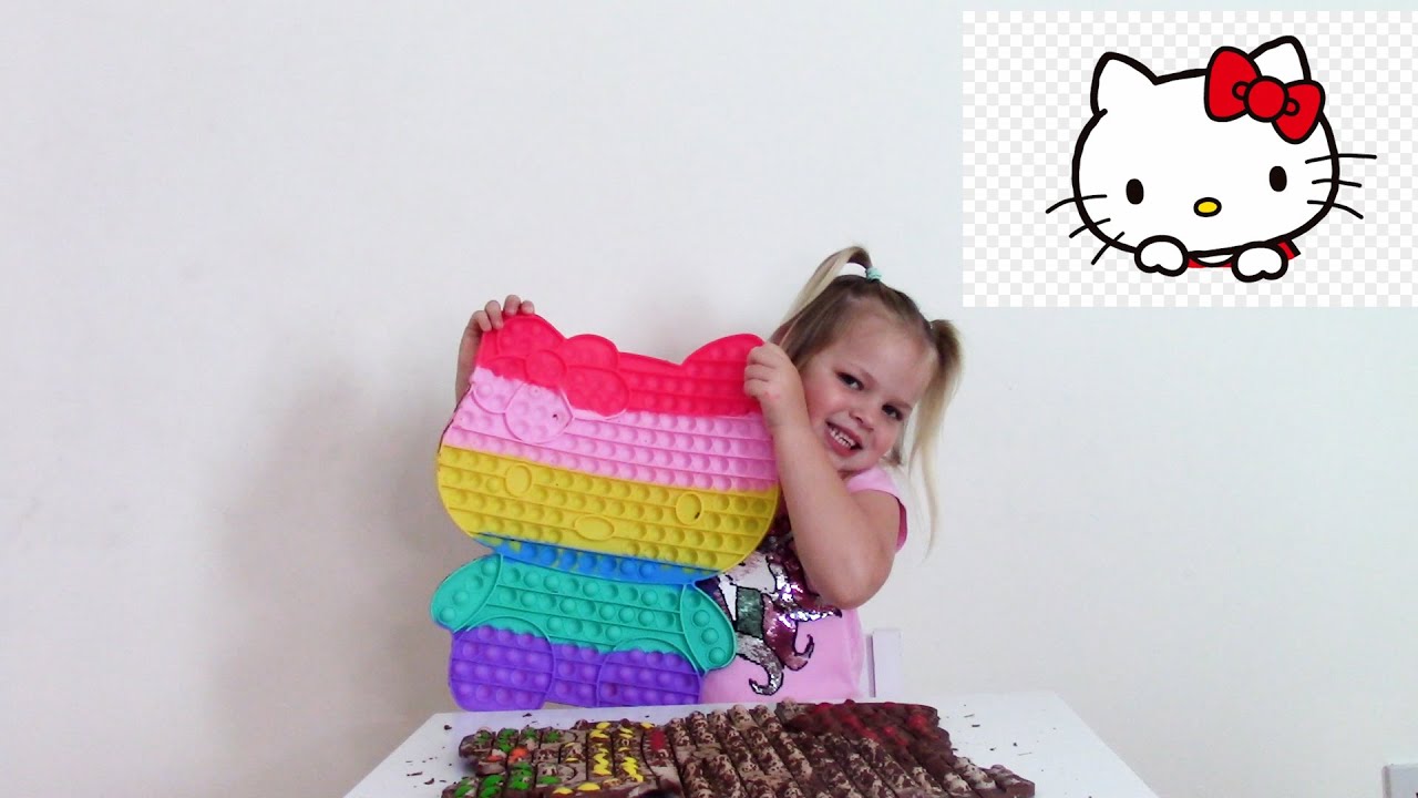 Erin plays with a giant Hello Kitty Poppit (pop it ) making a giant ...