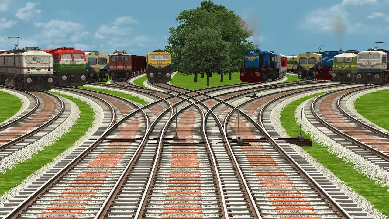 TEN RAIL TRAINS RUNNING BACK TO BACK AT CROSS CURVED RAILROAD TRACKS ...