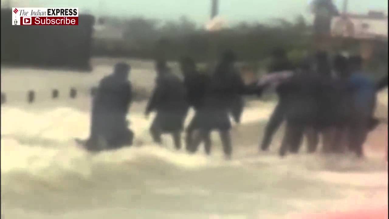 Man saved from being washed off in Chennai flood waters - YouTube