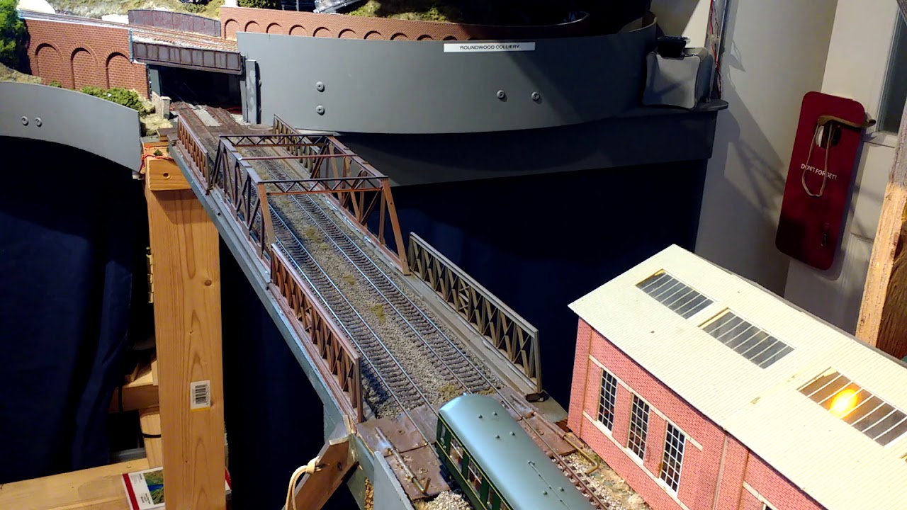 Low bridge action two trains cross - YouTube