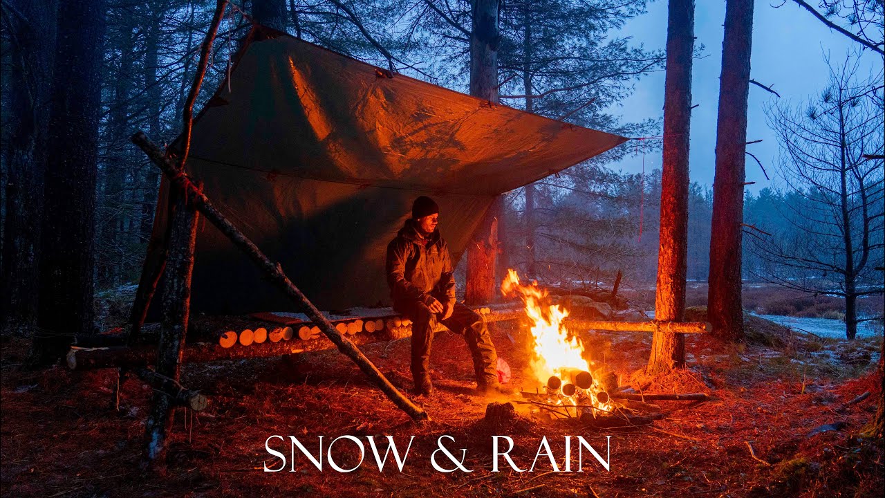 Winter Camping and Building Bushcraft Shelter in the Snow and Rain ...