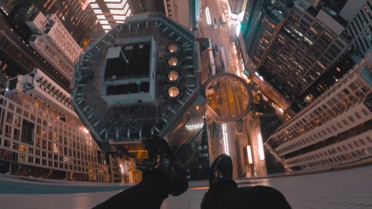 SITTING AT THE EDGE OF ONE OF THE HIGHEST BUILDINGS IN HONG KONG ...
