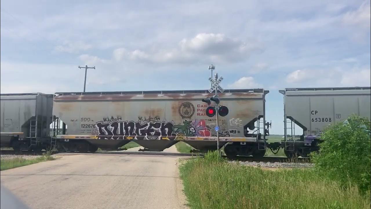 Loaded grain train with some cool graffiti - YouTube
