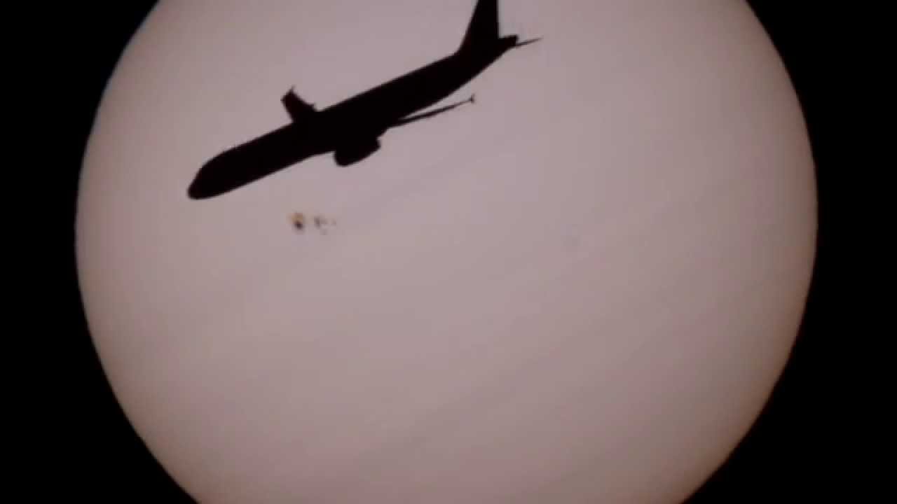 Plane is crossing while observing the sun through a telescope - YouTube