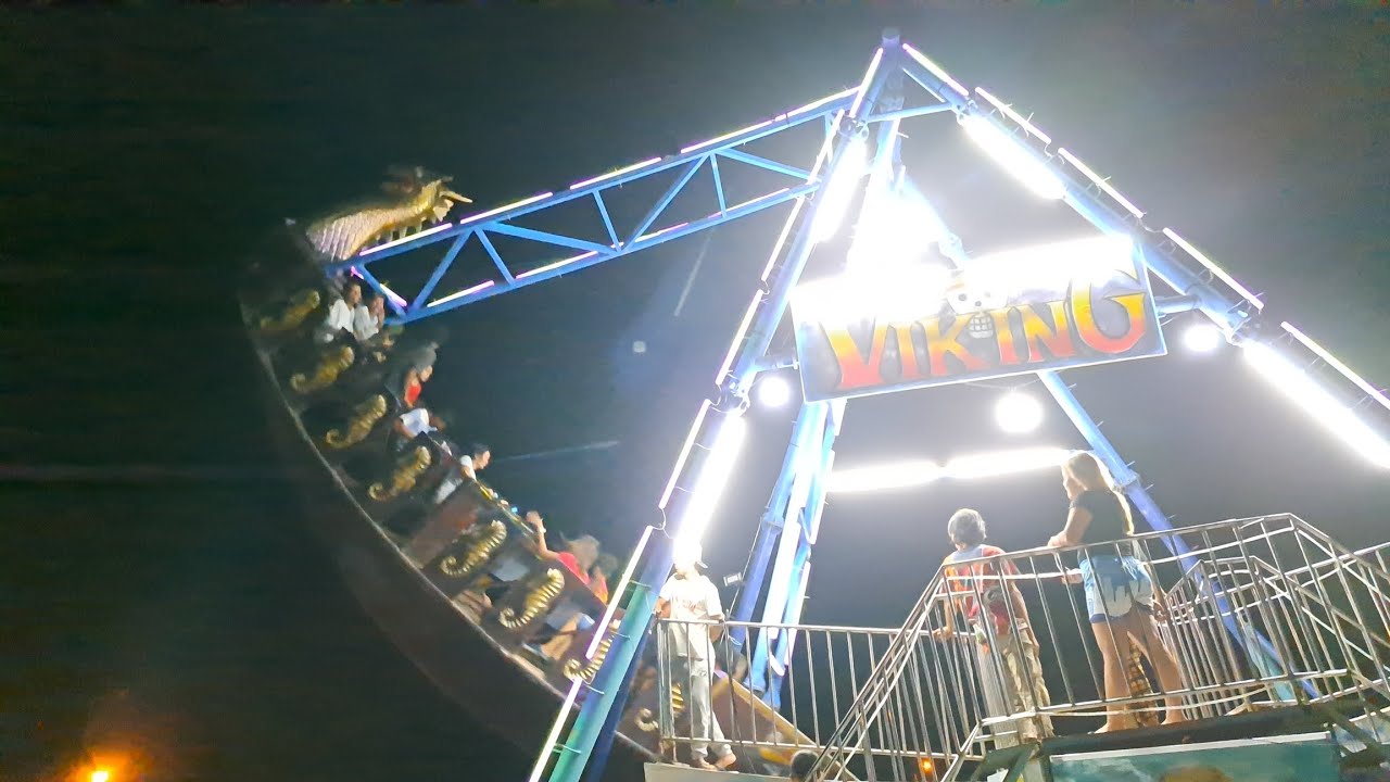 VILLAGE FAIR NEAR HOME...Bro Mark and my nephew Denver on a viking ride ...