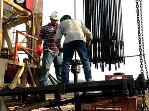 Connecting and Running Rods Back In Oil Well - YouTube
