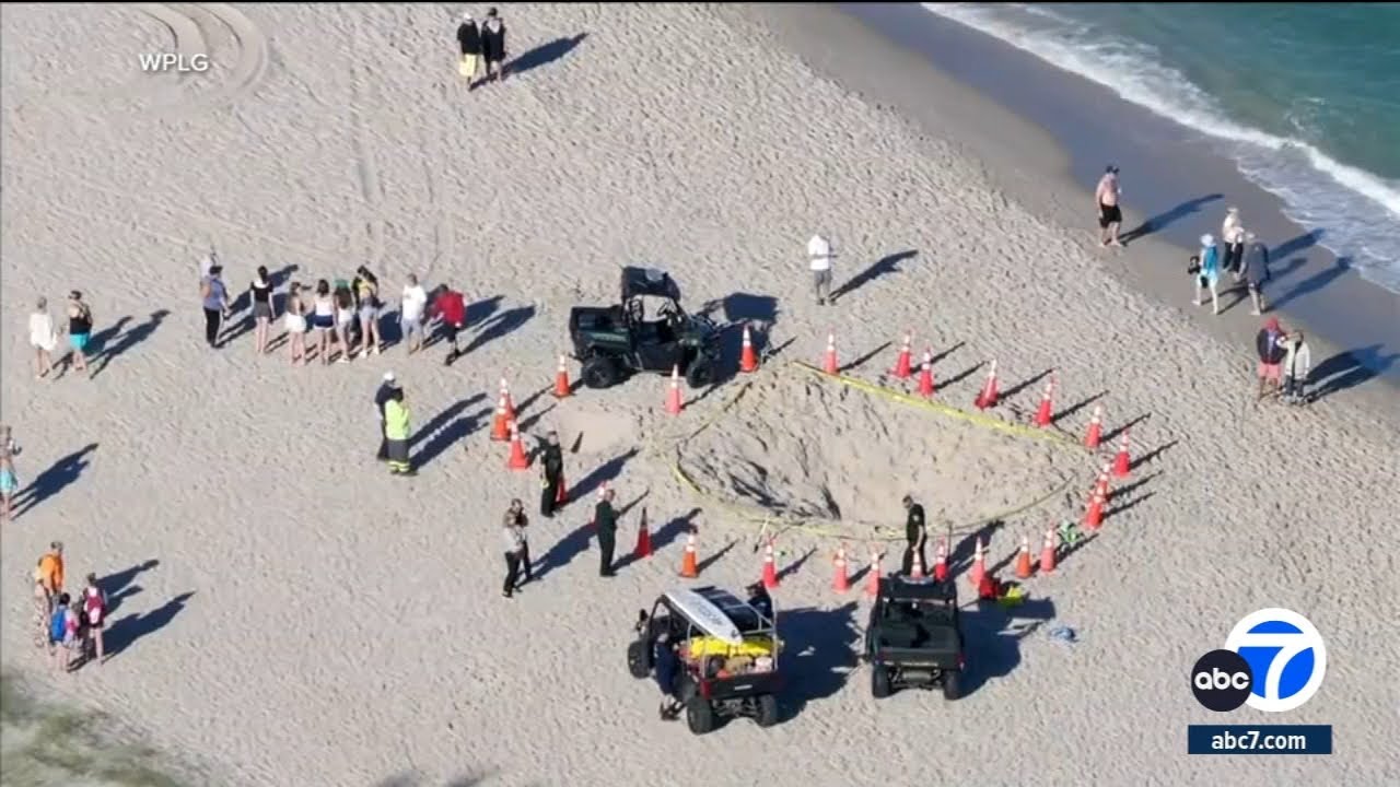 Child dies after falling into 6-foot hole on Florida beach - YouTube