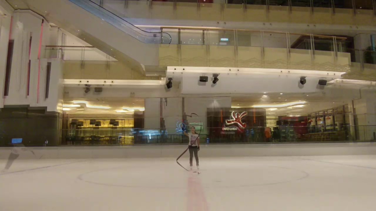 Roller skater skating with ribbon on ice - YouTube