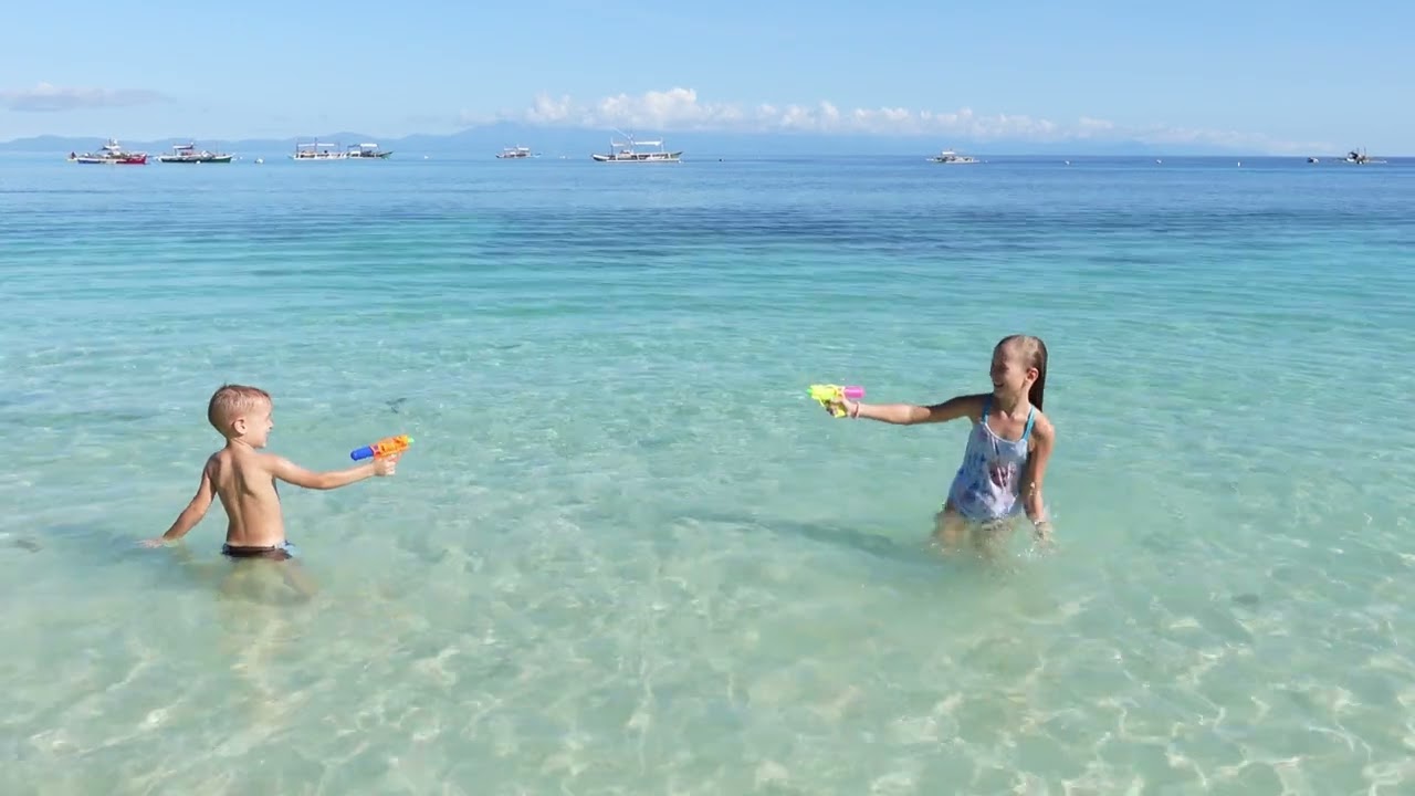 Children playing on the beach 4K - YouTube
