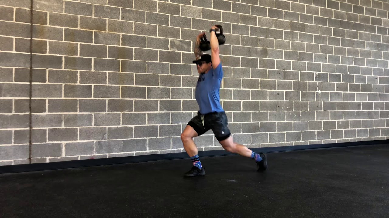 Dual Kettlebell Overhead Walking Lunge - YouTube