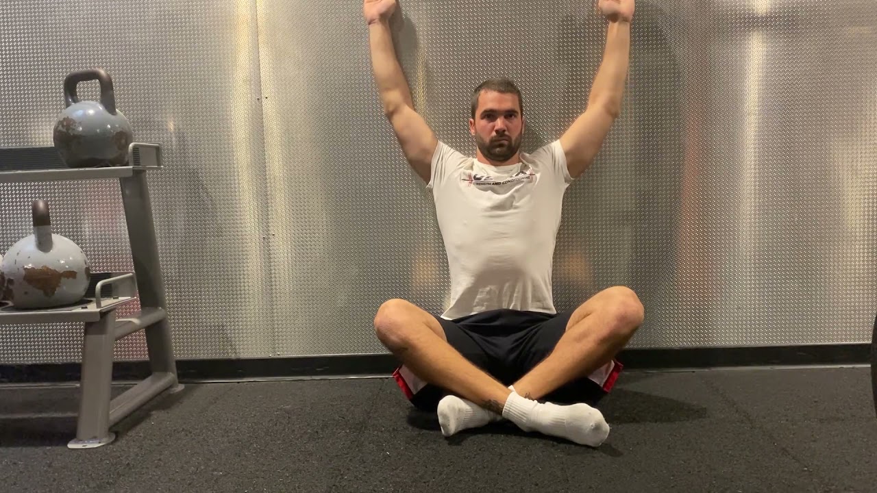 Seated wall slide - YouTube