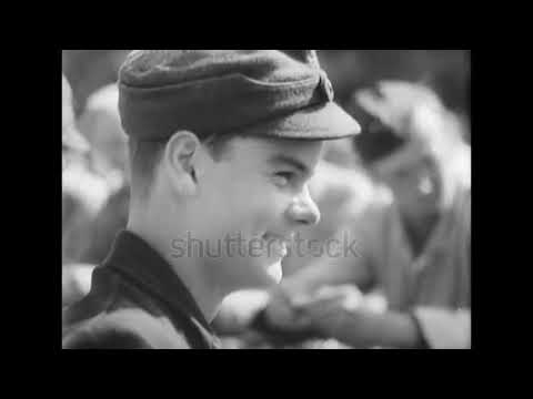 GERMANY - 1945 - Boys in the Hitler Youth inspect and repair spark plugs.