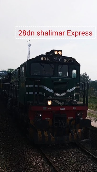 Shalimar Express 28dn passing Darul Ahsan railway station and 47up Rehman baba express waiting# ...