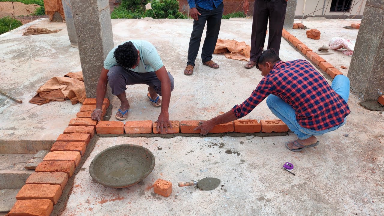 Brick work starting on slab first floor construction - YouTube