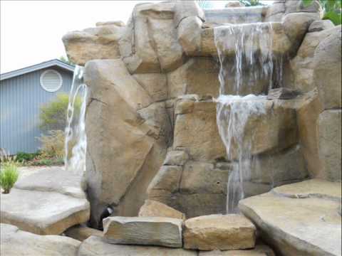 Rock waterfalls caves swimming pools entry ways - YouTube