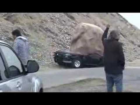 Boulder crushes parked car
