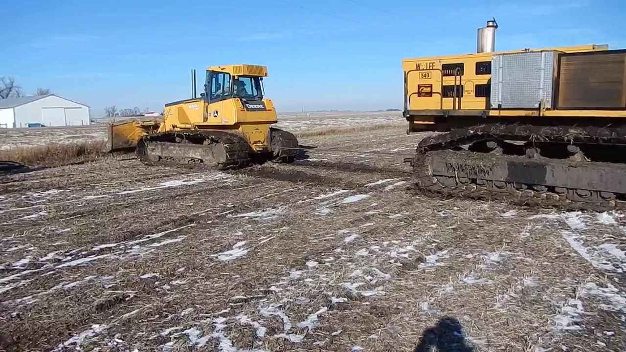 Wolfe Plow burying a tile line 6.5ft Deep - YouTube