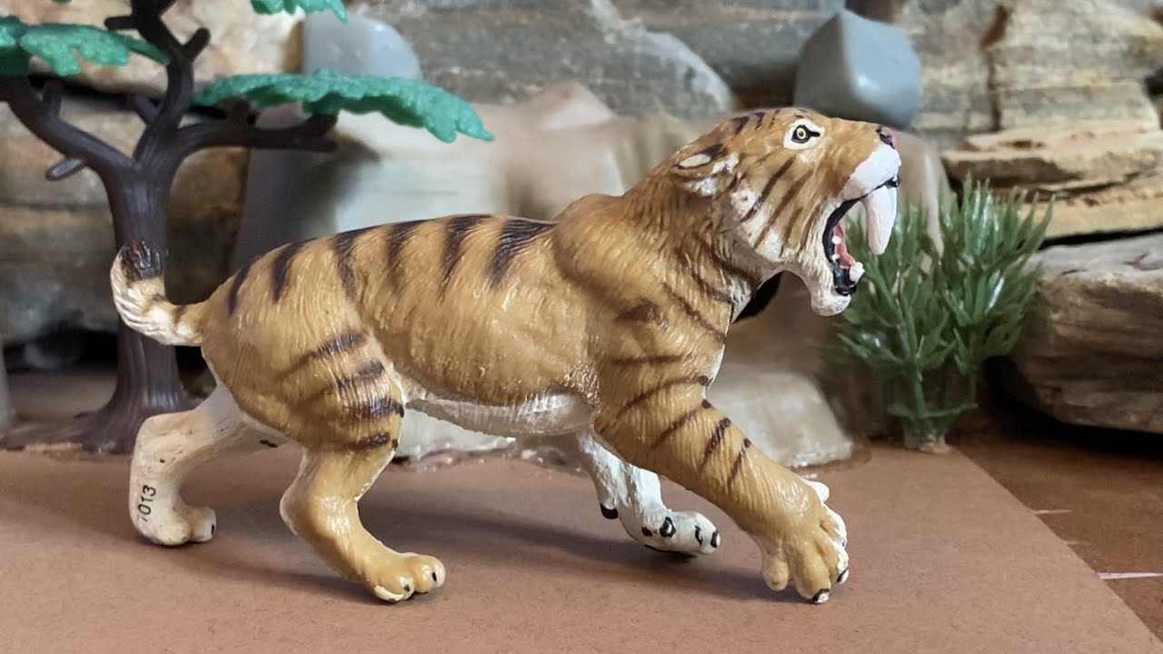 Safari Ltd Smilodon Figures - YouTube
