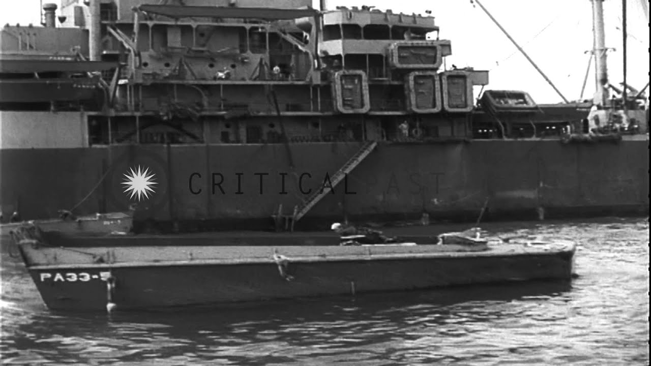Rhino barges loaded from an LST (Landing Ship, Tank) during the Utah ...