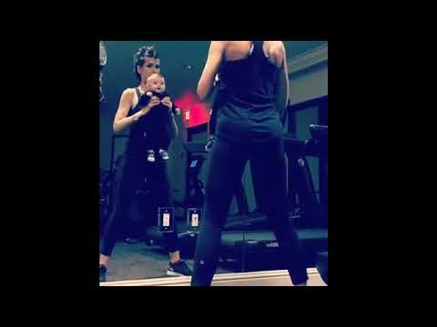 Playboy model Ildiko Ferenczi gets in a quick workout with her son