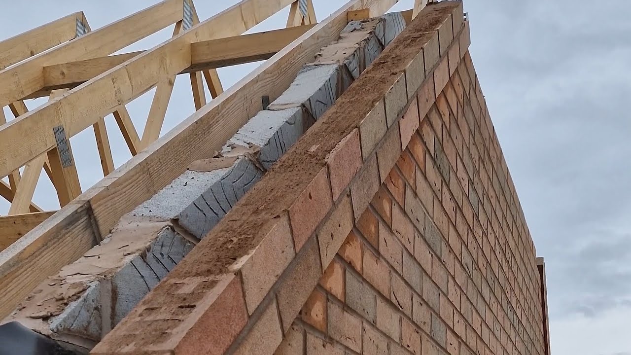 Laying oversail course to gable end. - YouTube