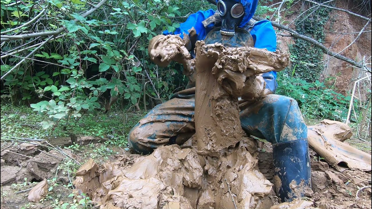 Jeans, rainwear and rubberboots in deep quarry mud 2 - YouTube