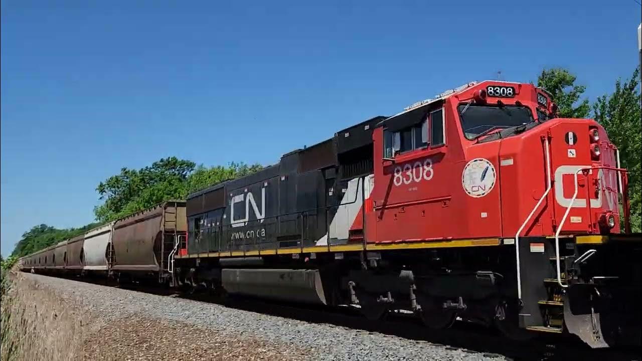 CN 3014 leads B730 with a horn salute - YouTube