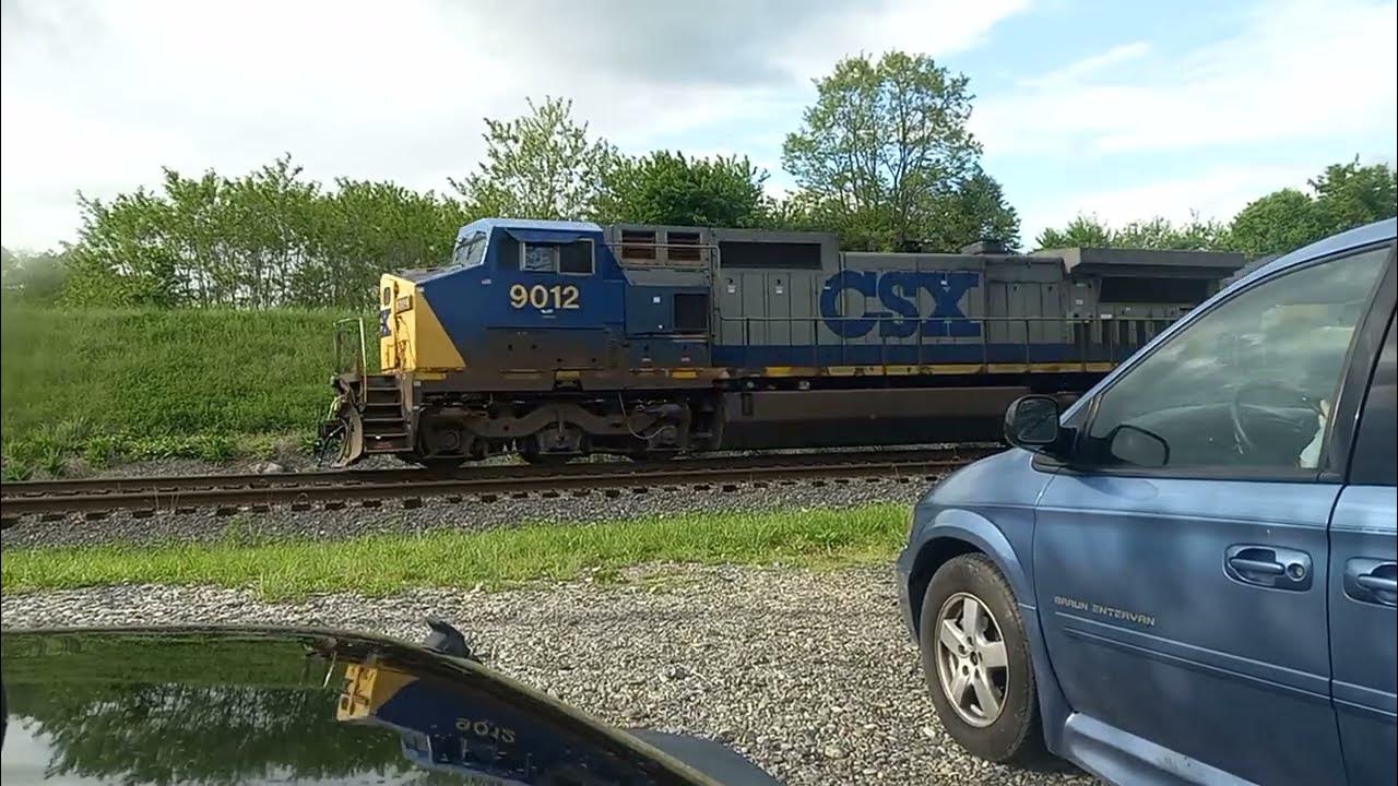 csx Q217 empty autorack train with a dash 9 leading - YouTube