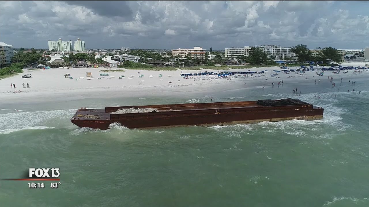 Barge breaks loose, runs ashore on St. Pete Beach - YouTube