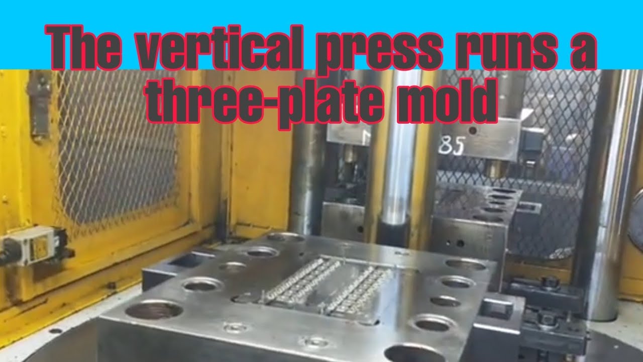 A vertical press run a three-plate mold? - YouTube