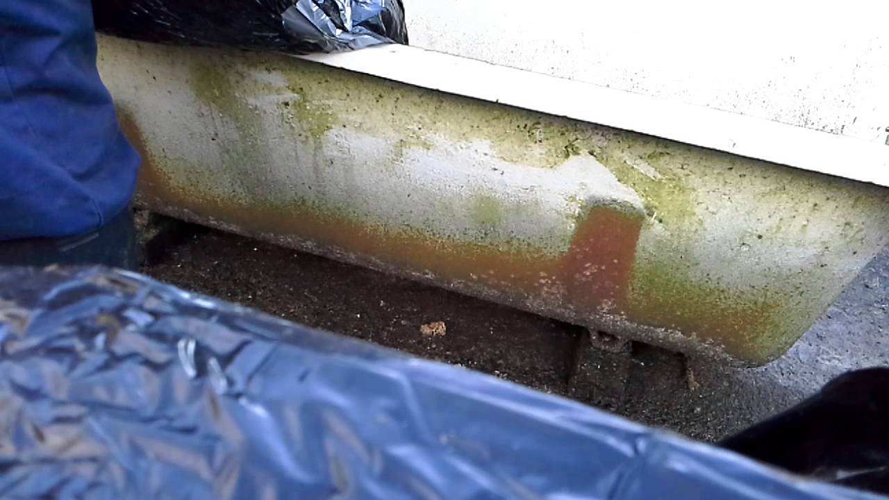 Opening a small square lawn silage bale - YouTube