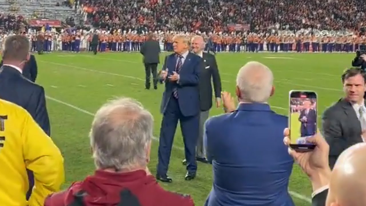 Trump BRUTALLY booed at football game - YouTube