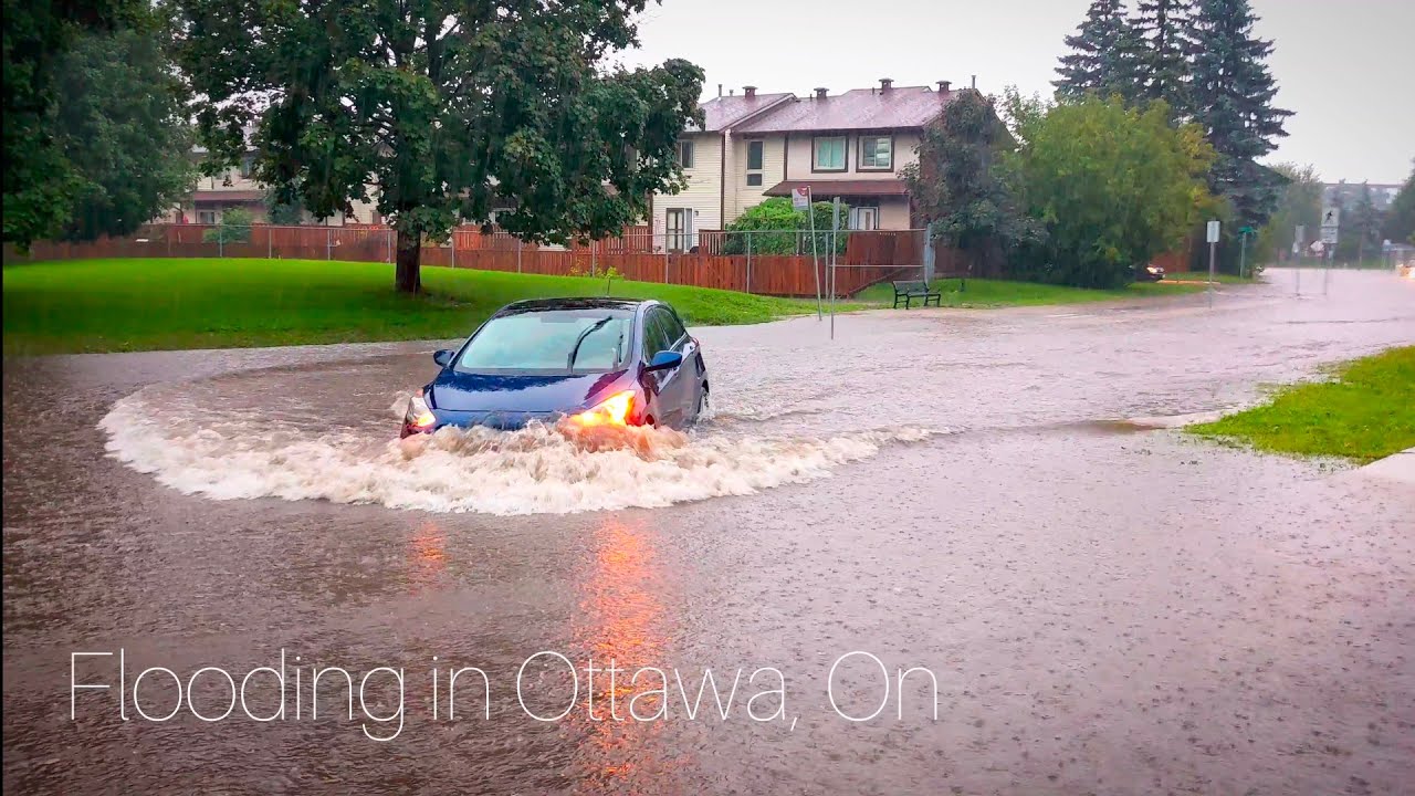 Waiting at a bus stop during Ottawa Flash Flood - YouTube