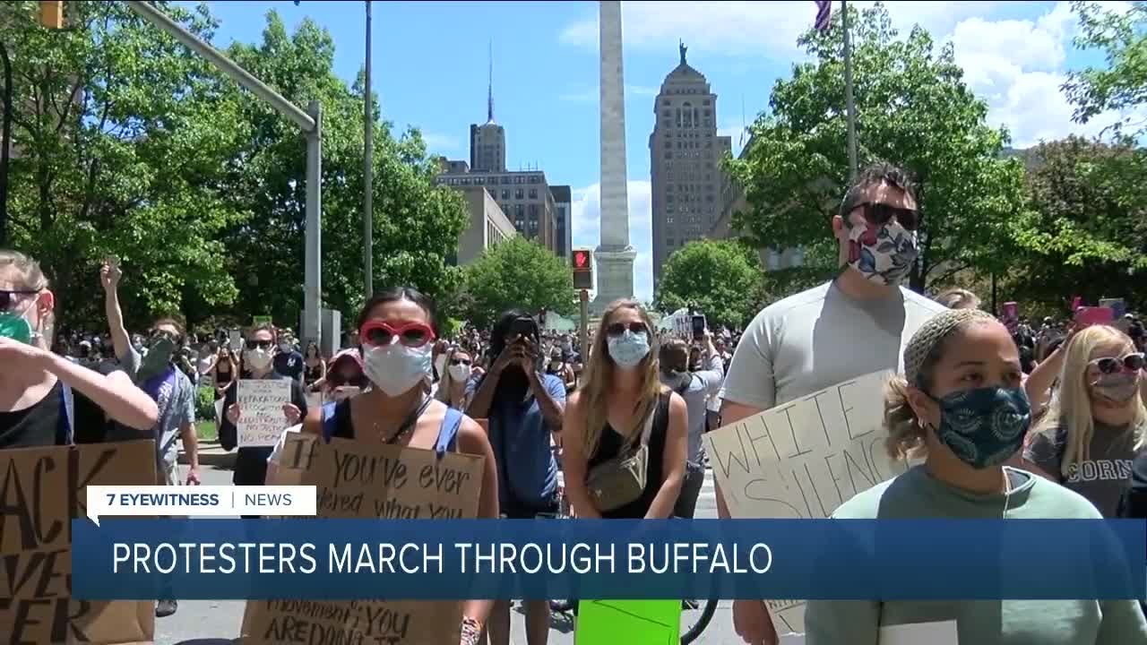 Hundreds of protestors peacefully march through the streets of Buffalo ...