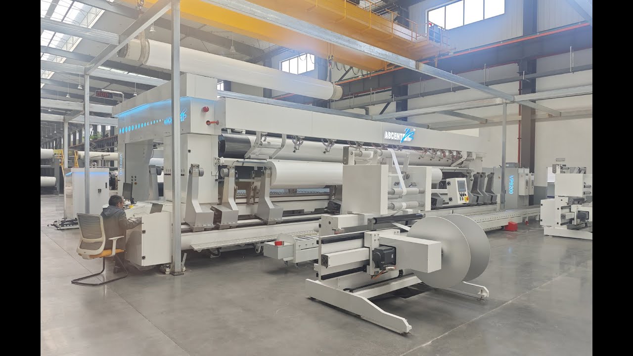 Primary slitting machine for BOPP film synthetic paper - YouTube