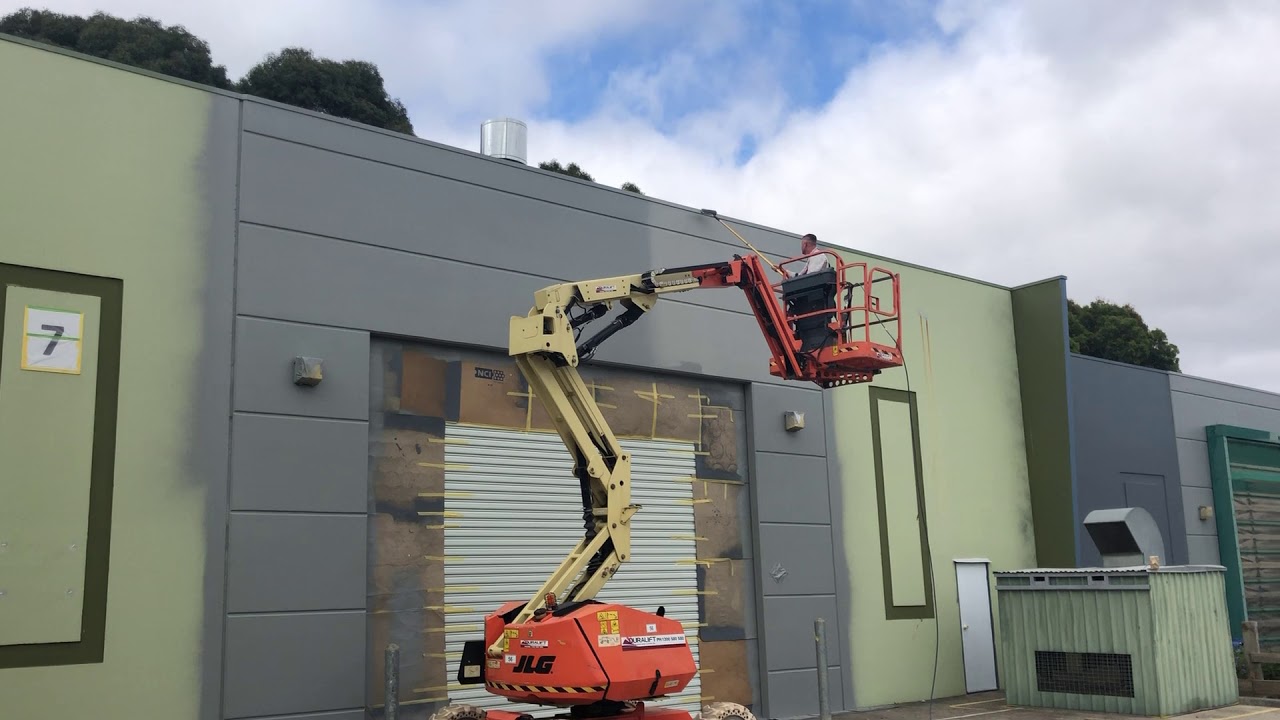 Painting exterior walls .Spraying and Back Rolling - YouTube