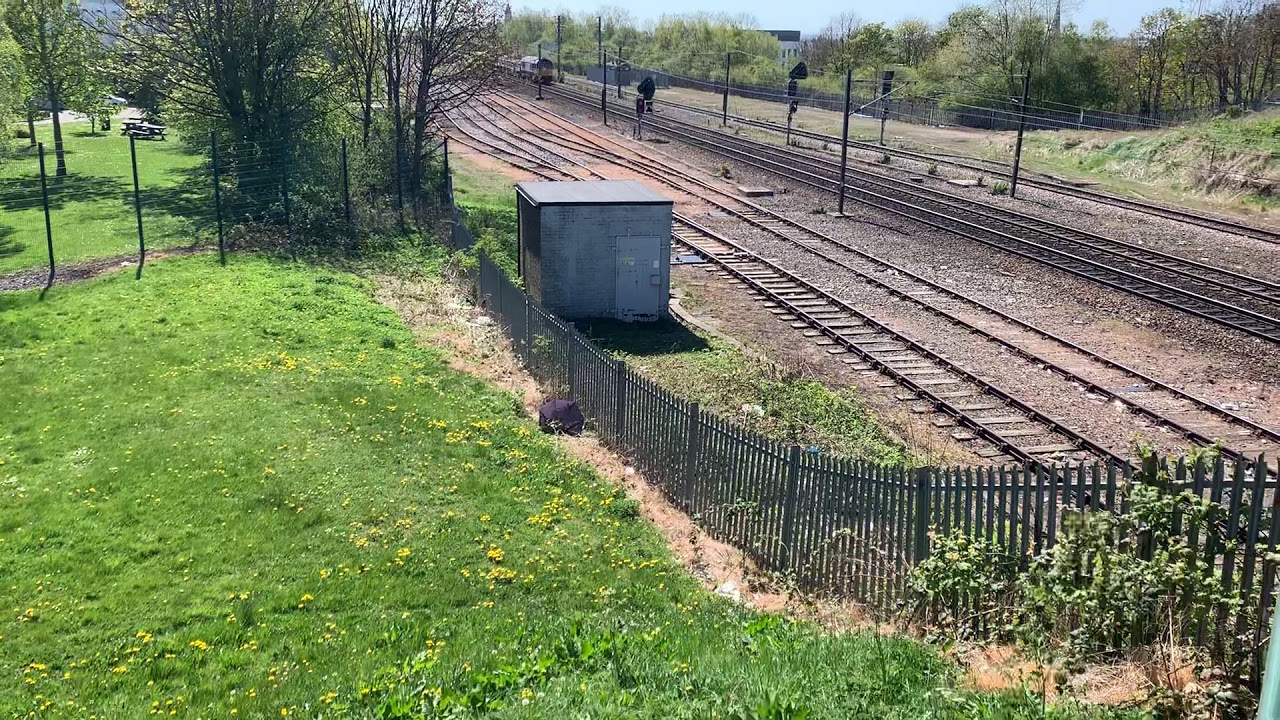DRS Class 66302 with ballast wagons pass Darlington on Redcar B.S.C Ore ...