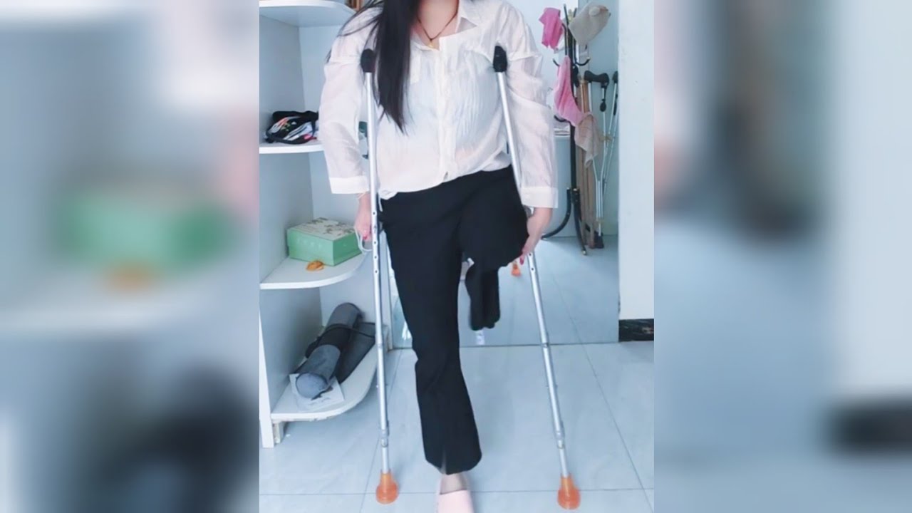 Amputee Girl Posing With Crutches & Empty Pant Leg | Amputada | One ...