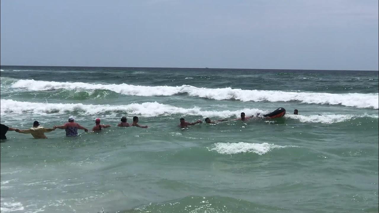 Beachgoers Form Human Chain to Save Swimmer Struggling in Florida Surf - YouTube