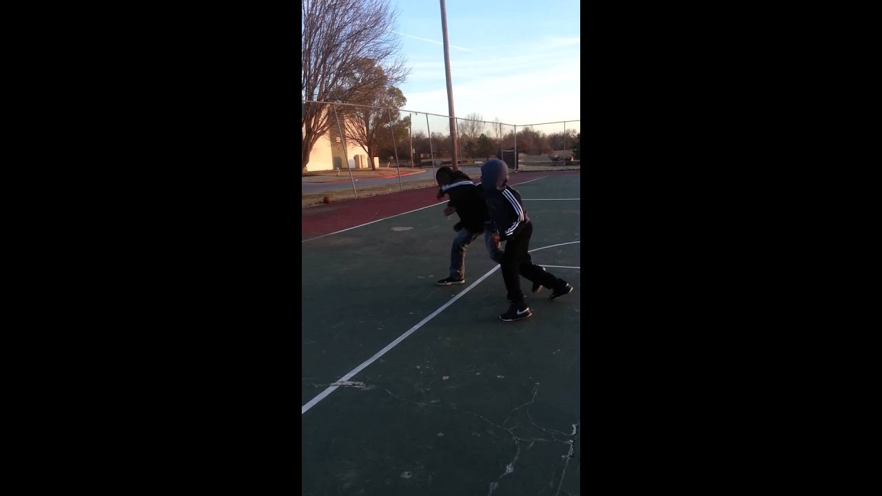 Kids fight over basketball game - YouTube