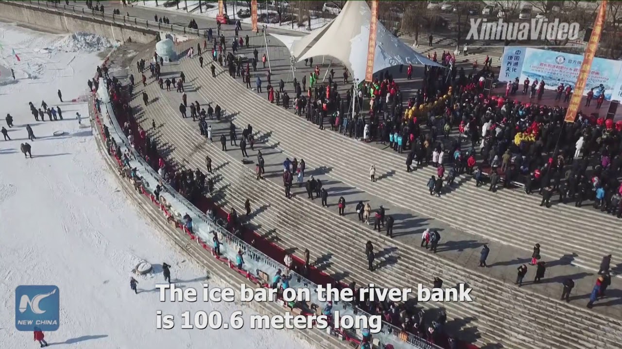 China breaks records for world's largest snow painting, longest ice bar ...