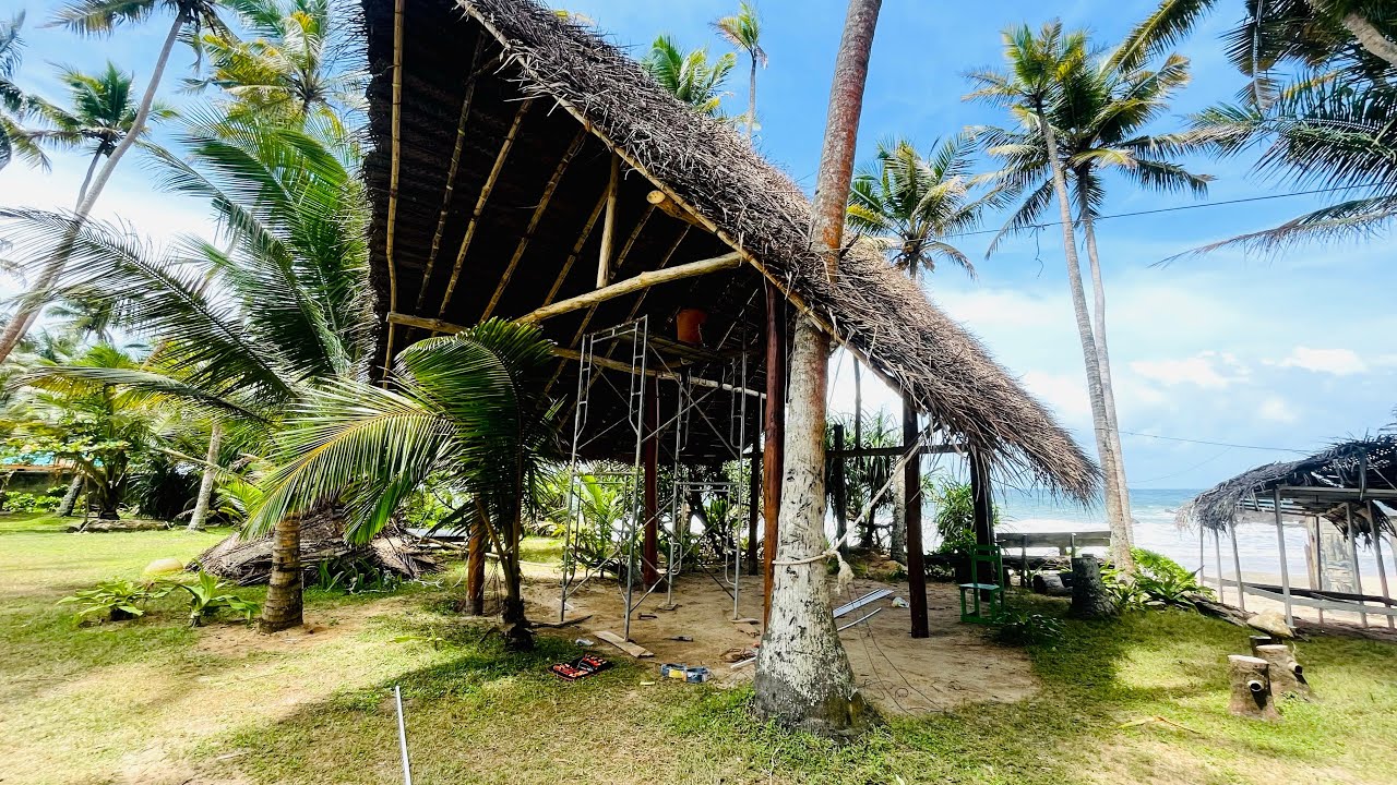 How to roof a cabana with weaved coconut leaves - YouTube