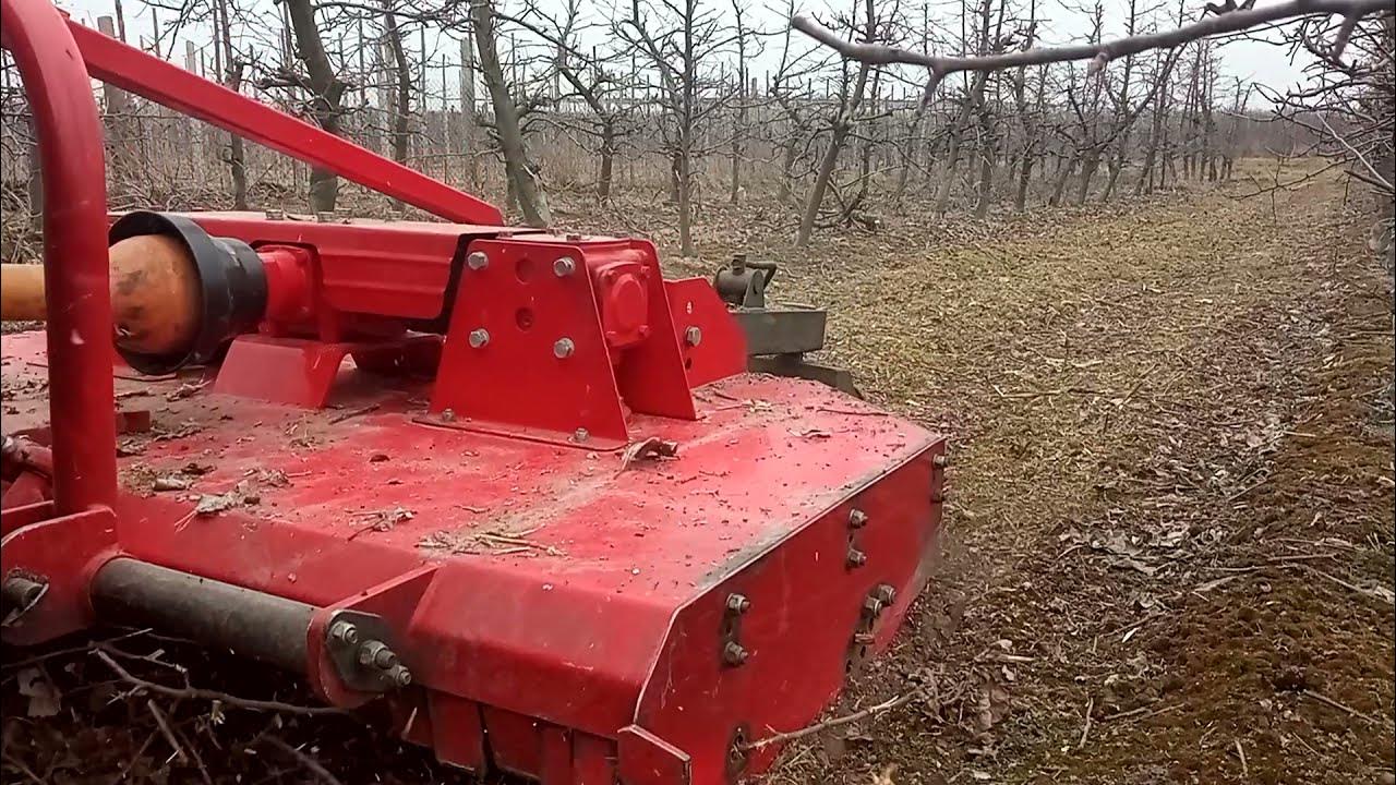 Rozdrabnianie gałęzi po cięciu w sadzie. Kosiarko-rozdrabniacz mcms Kubota L5040. film # ...