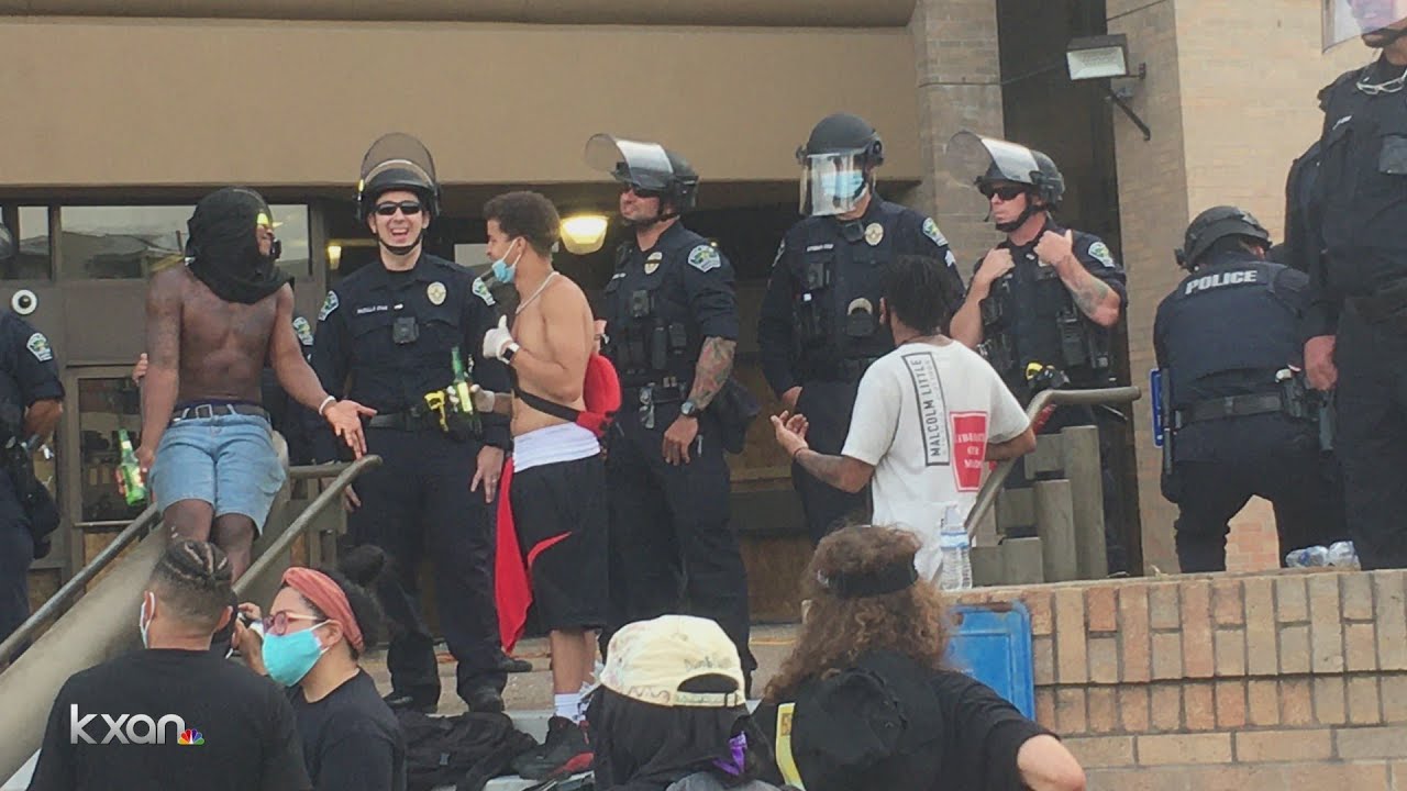 Photo of Austin officer, protesters smiling - YouTube